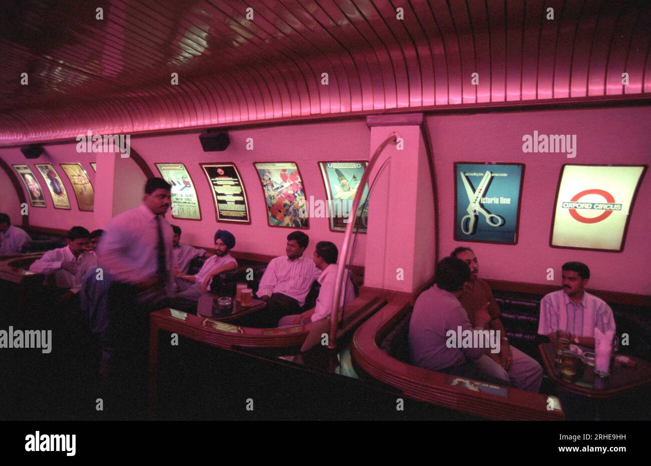 a Cyber cafe on a Road with Shops and Traffic in the city of Bangalore ...