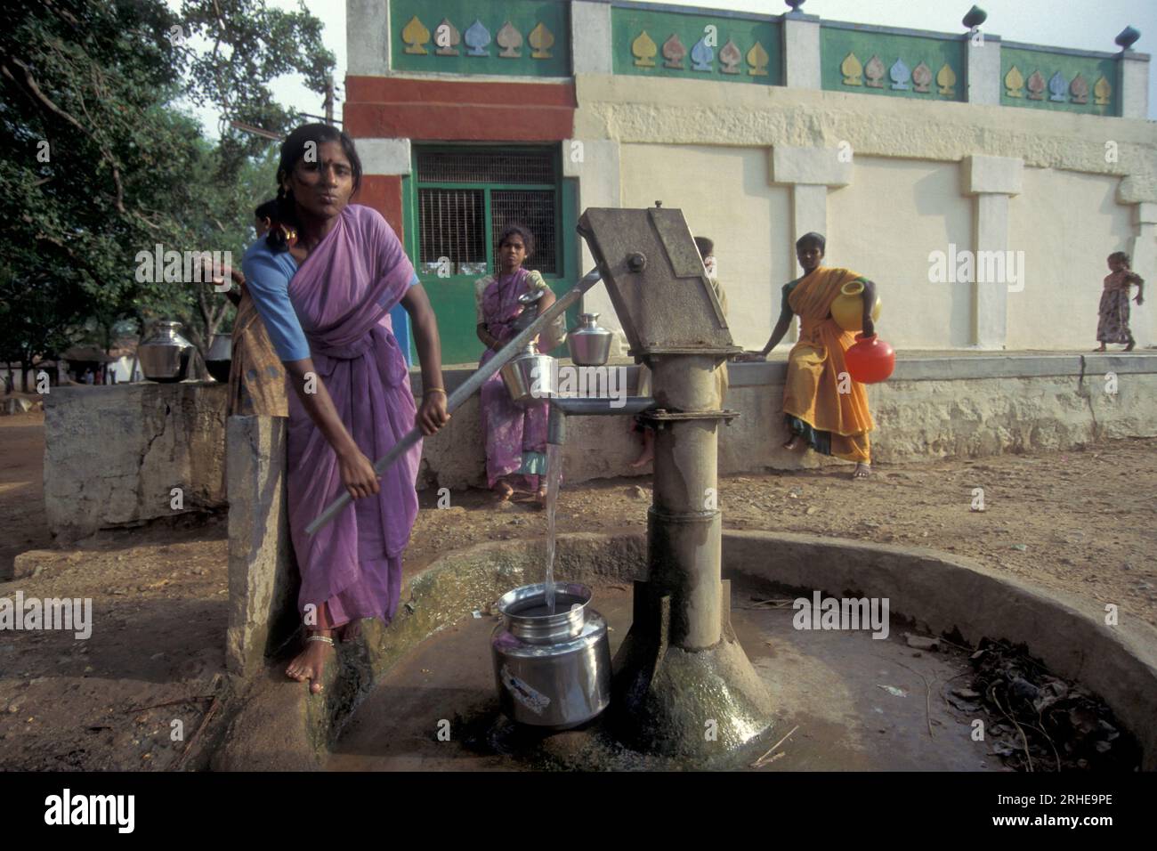 Women at a Water Deep Well or Spring in the city of Bangalore in the ...