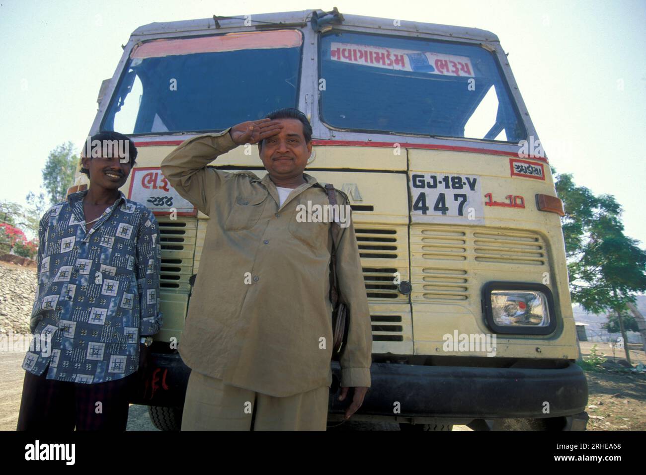 a Bus Driver in fron of his Public Bus in the city of Surat in the ...