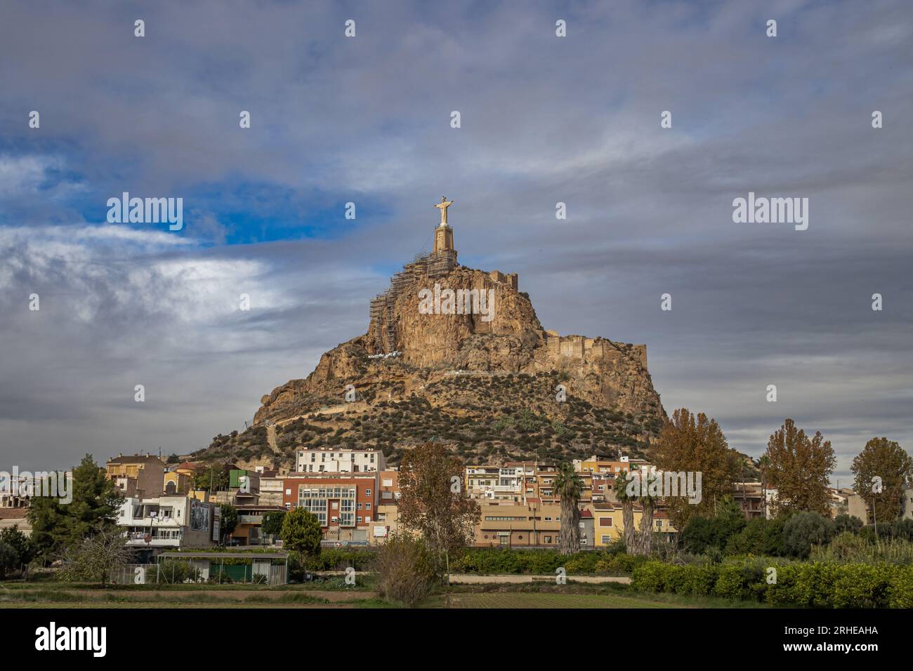 Castle of Monteagudo on the top of a huge rock with a giant statue of ...