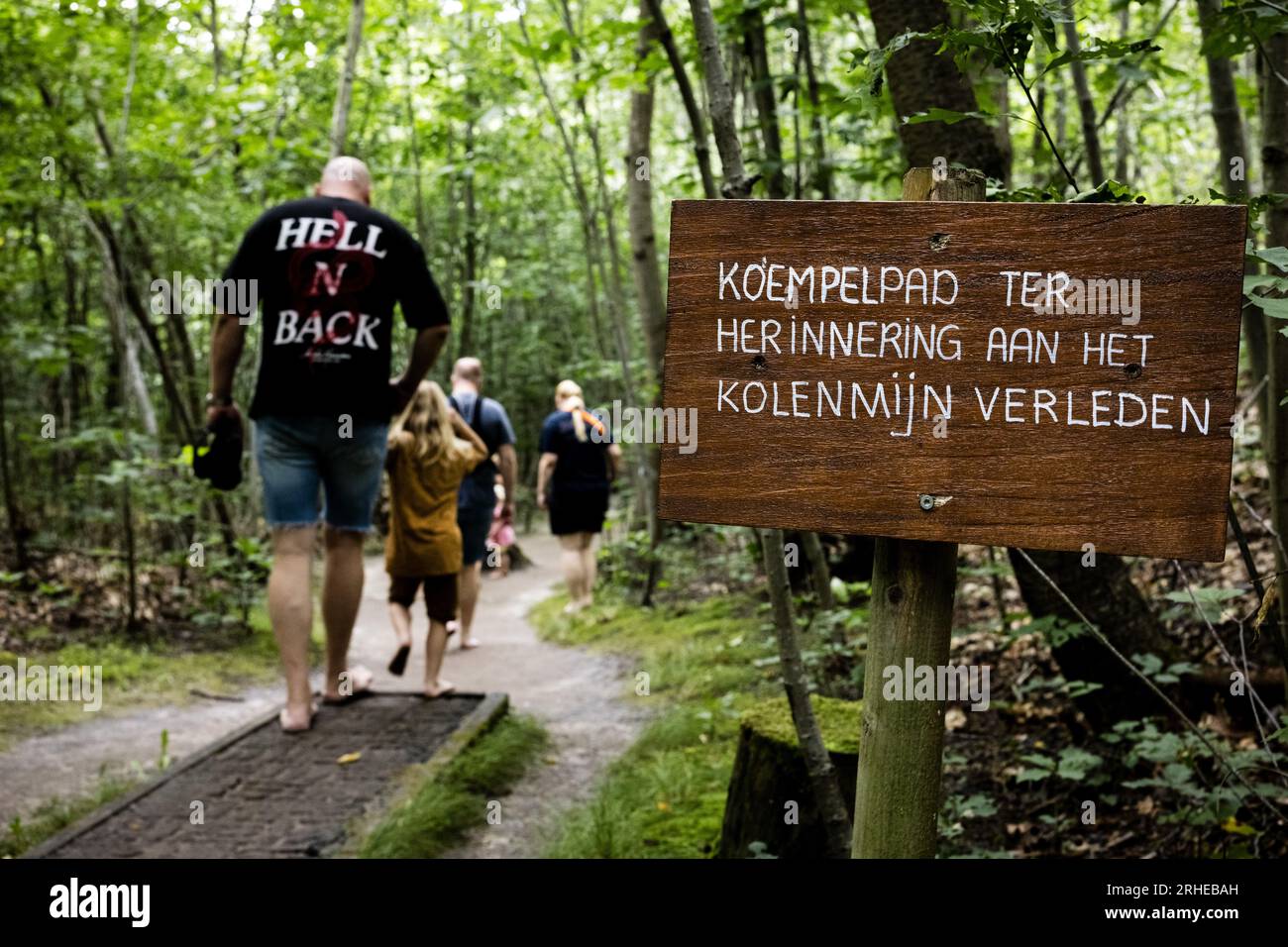 BRUNSSUM - Visitors to the barefoot park walk over various obstacles ...