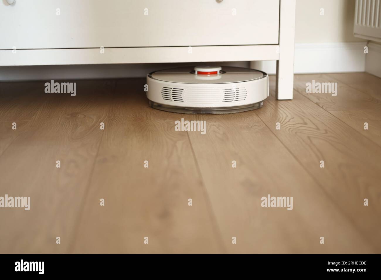 Wireless autonomous robotic vacuum cleaner vacuums with brushes under ...