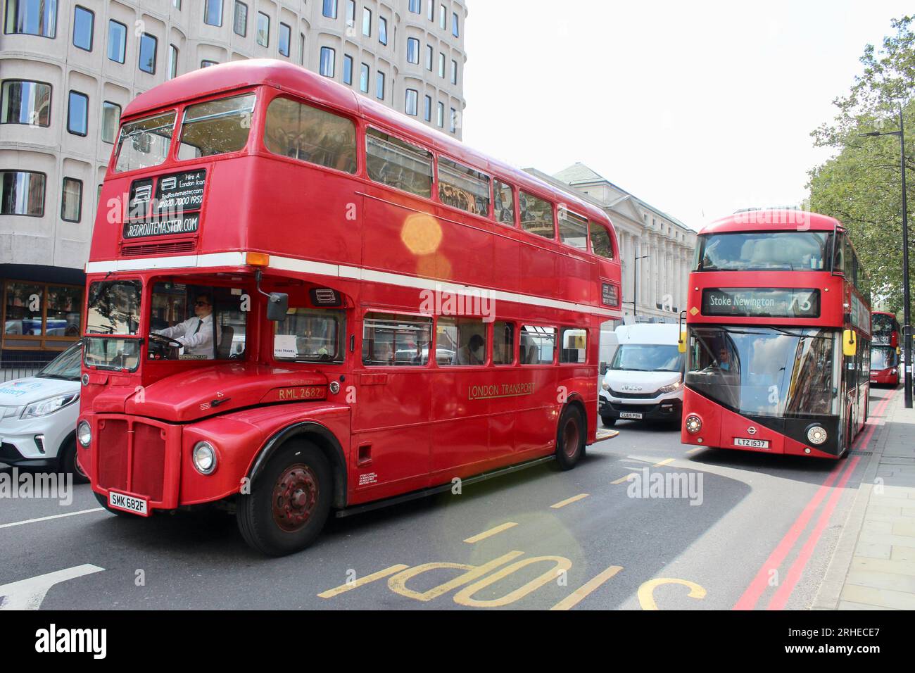 an old style routemaster bus and a new style route master bus on euston ...