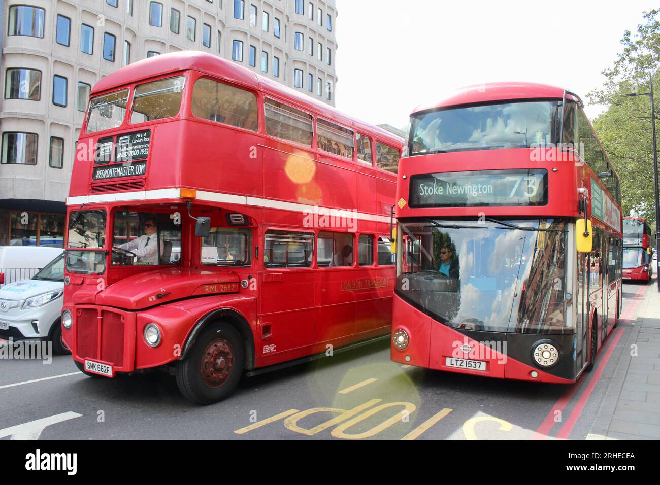 an old style routemaster bus and a new style route master bus on euston ...