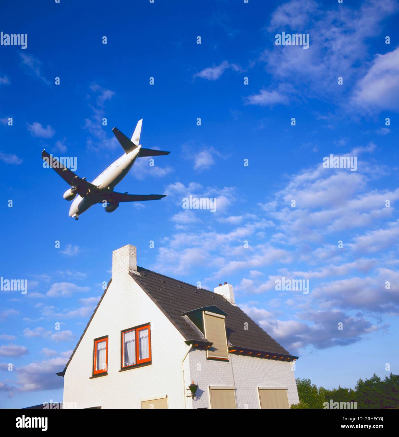 Large jet aircraft on landing approach over suburban housing Stock ... Large jet aircraft on landing approach over suburban housing Stock ...