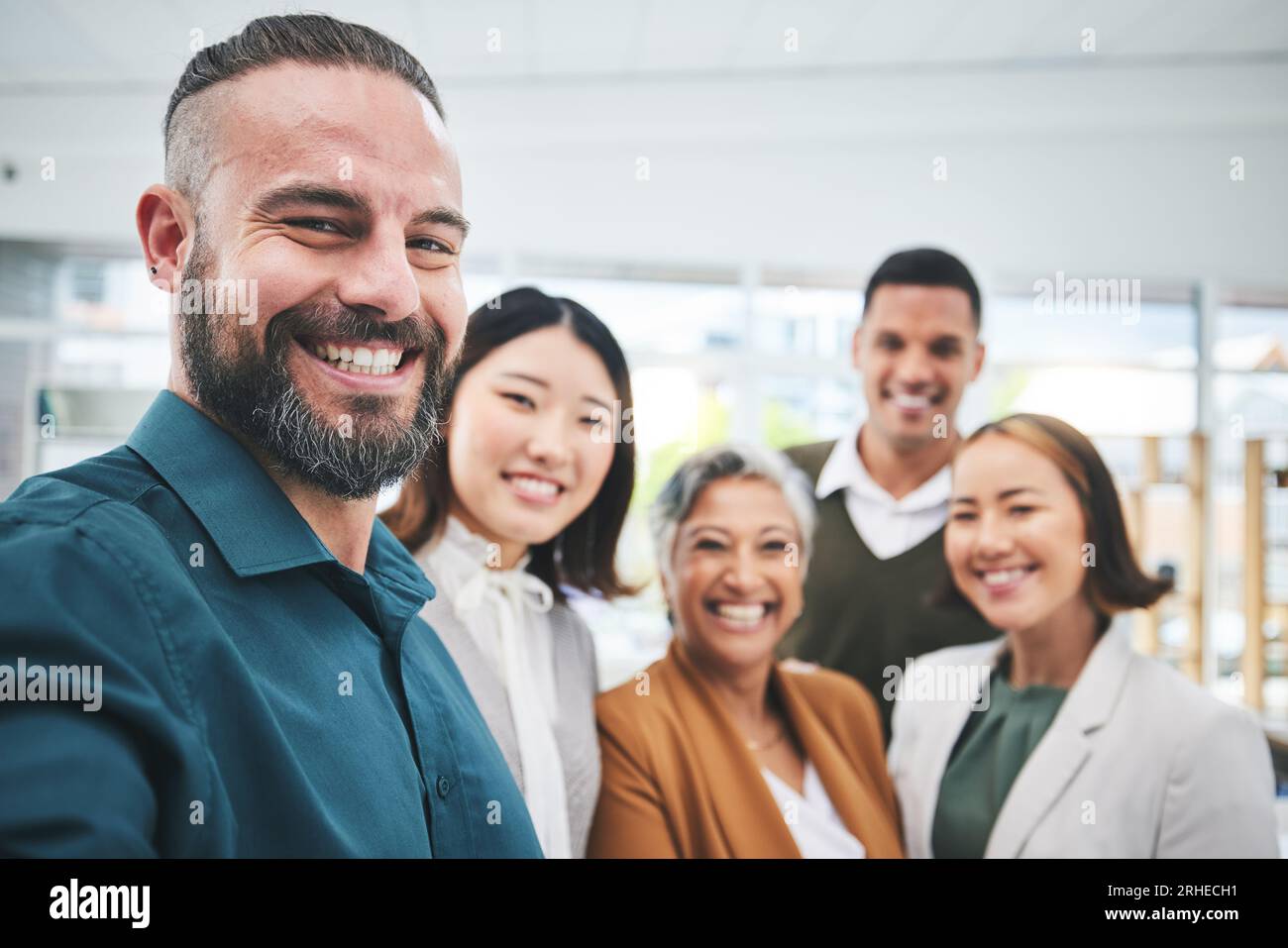 Selfie, portrait and happy business people together in office for team building, collaboration ...