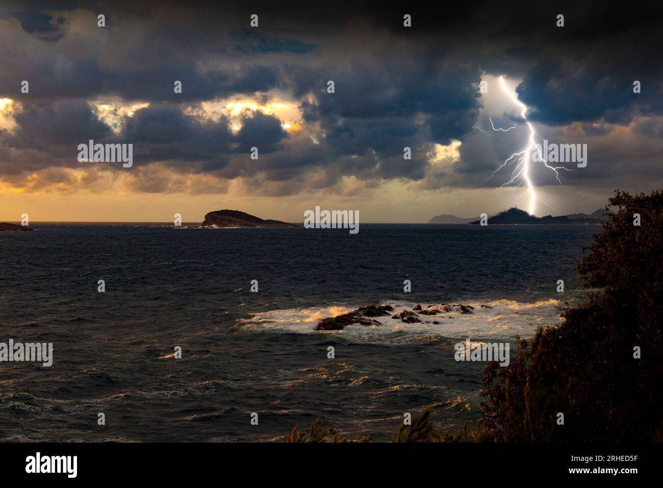 Storm with lightning strikes over ocean Stock Photo - Alamy