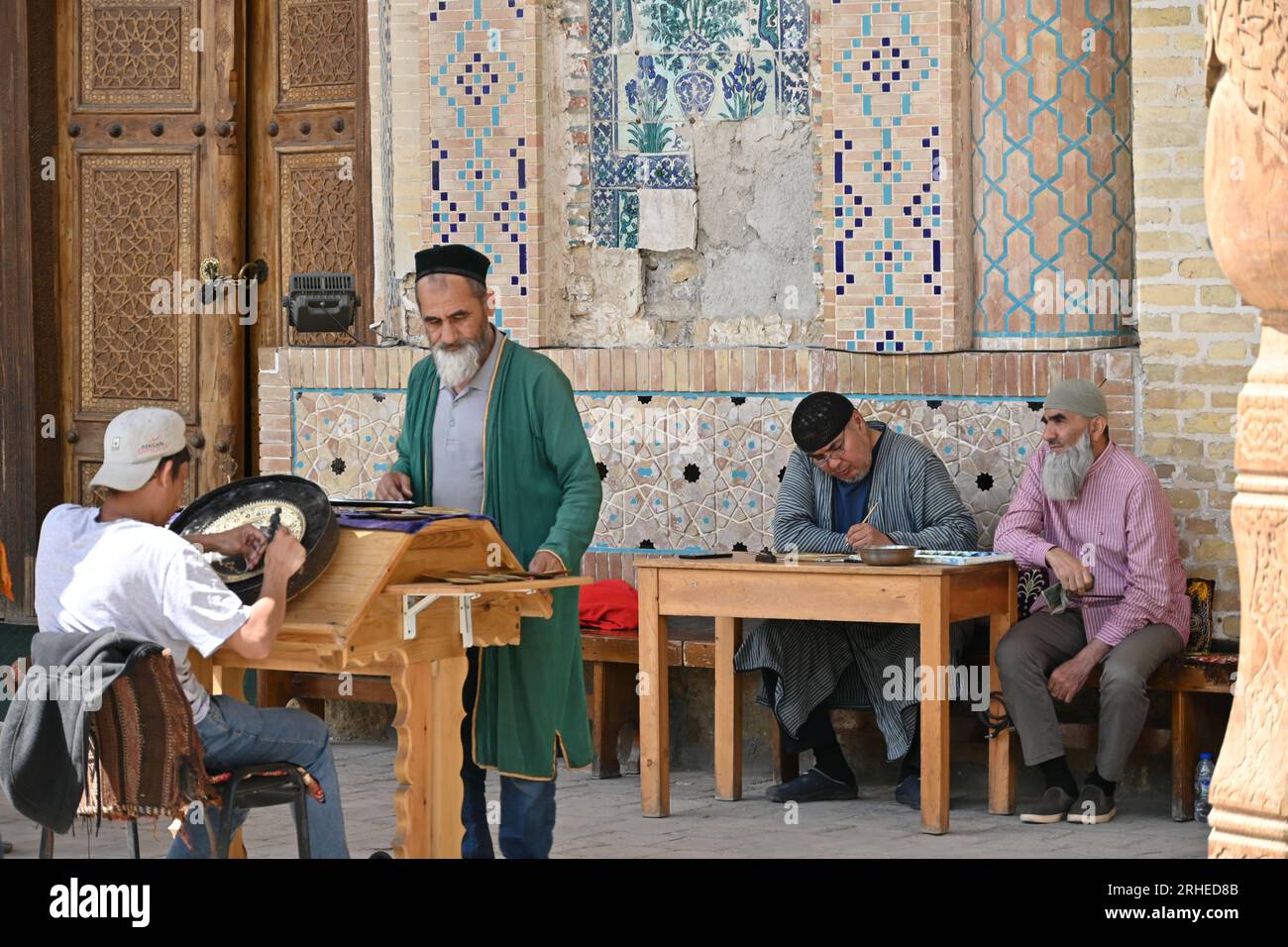 Uzbek men working outside a mosque in the old city of Bukhara ...