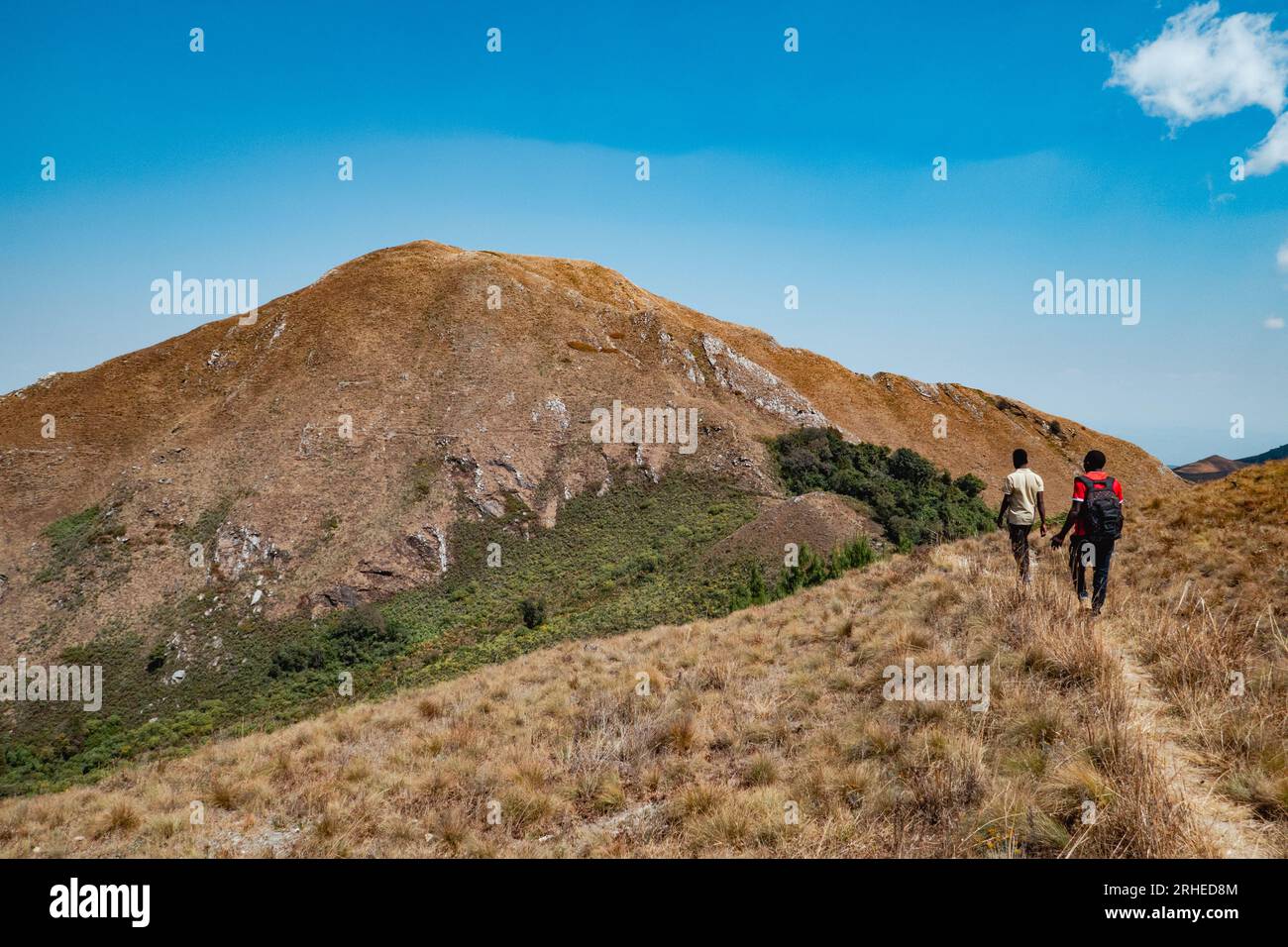 Rear view of hikers against background of Mbeya Peak in Tanzania Stock ...