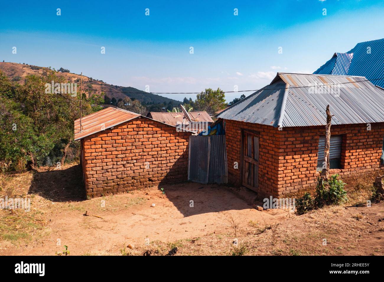 Scenic view of small scale maize farms with houses at Mbeya Town in ...