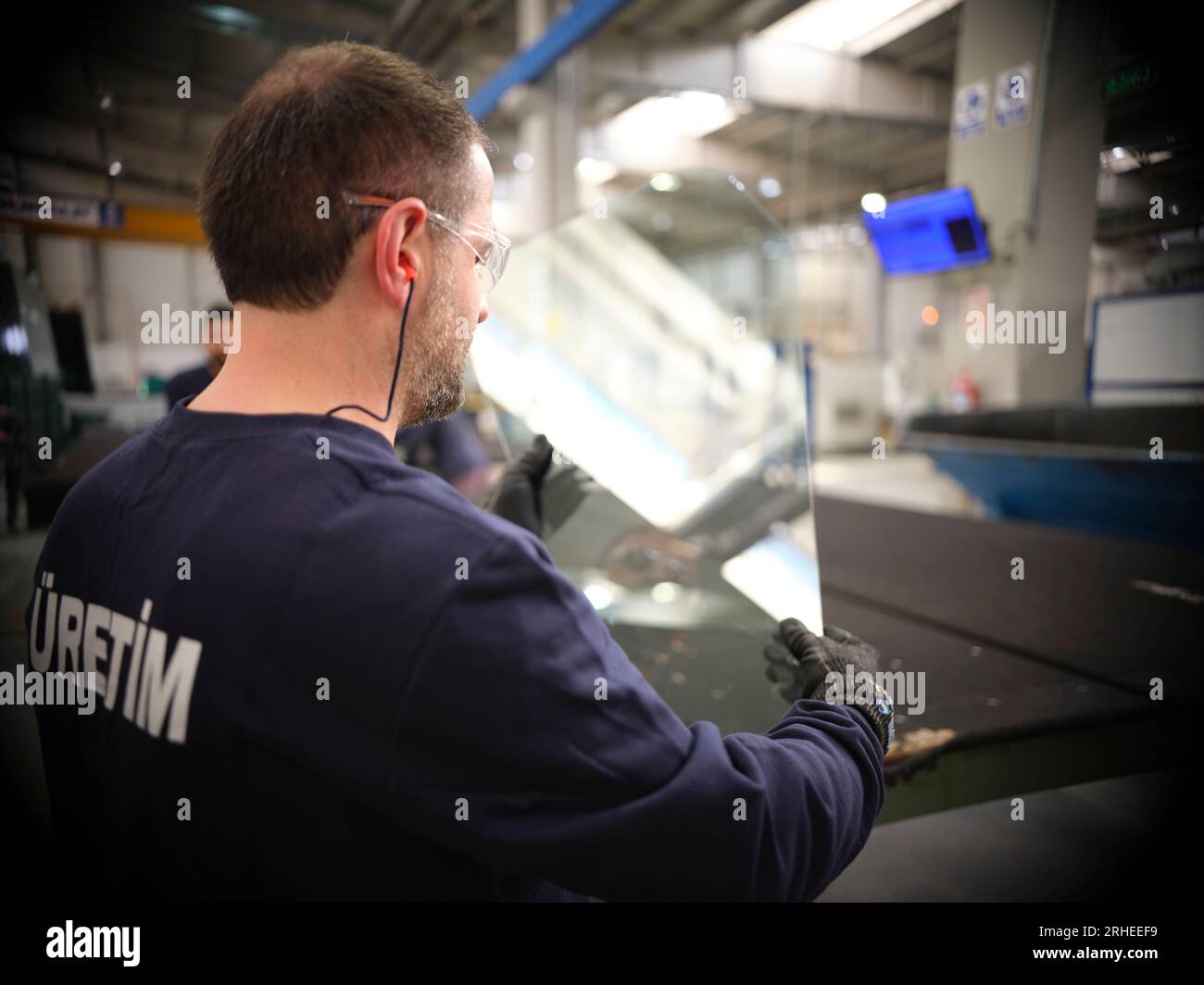 Factory for windows and car Windshield production. Manual worker ...