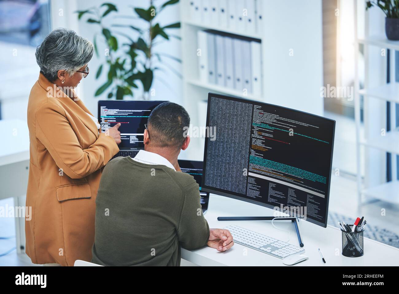 Teamwork, coaching and programmer with business people in office for coding, developer or ...