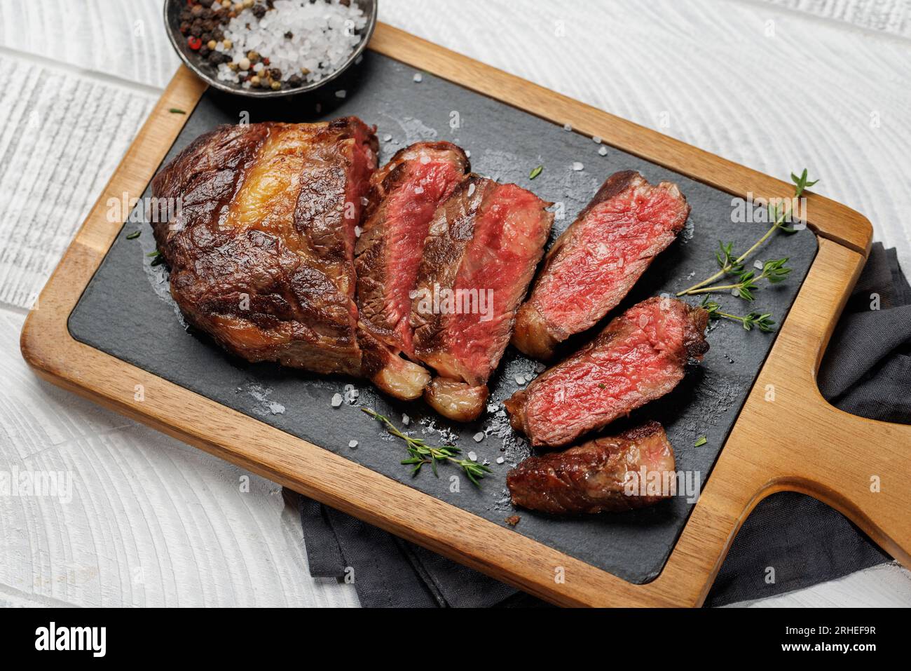 Deliciously juicy sliced beef ribeye steak, perfectly cooked and ready ...