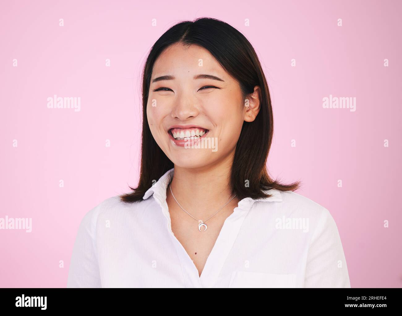 Portrait, happy and asian woman laugh in studio with funny, joke or ...
