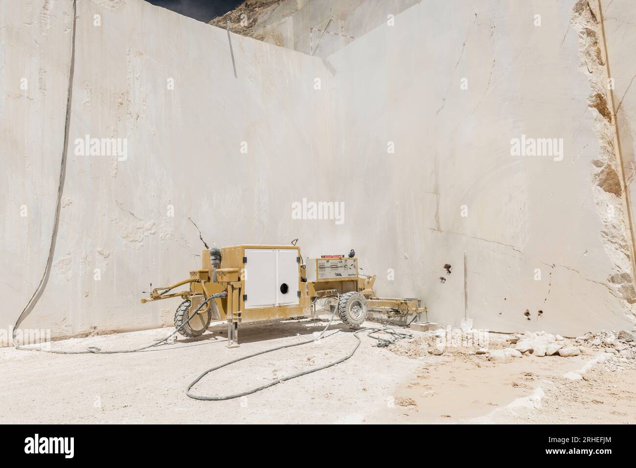 beautiful and artistic photograph of a marble mine. including men ...