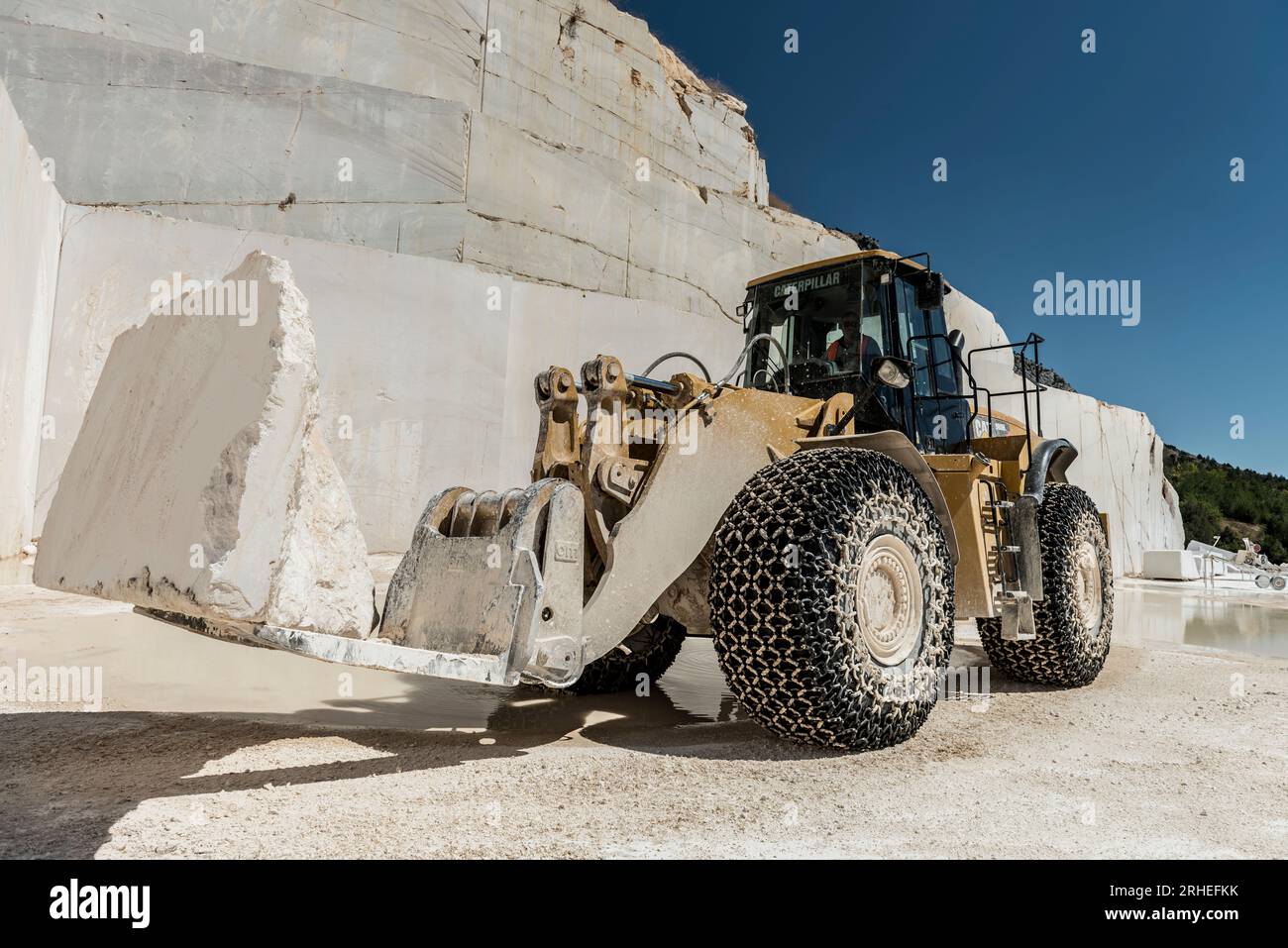 beautiful and artistic photograph of a marble mine. including men ...