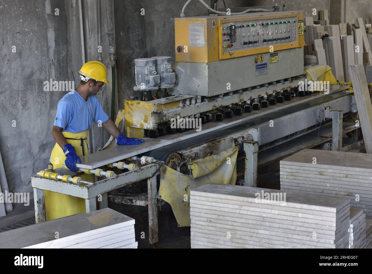 man in stone cutting factory/workshop. stone mine. marble mine ...