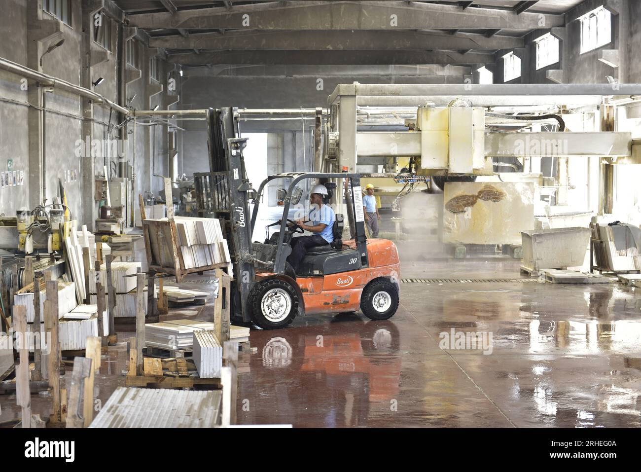 man in stone cutting factory/workshop. stone mine. marble mine ...