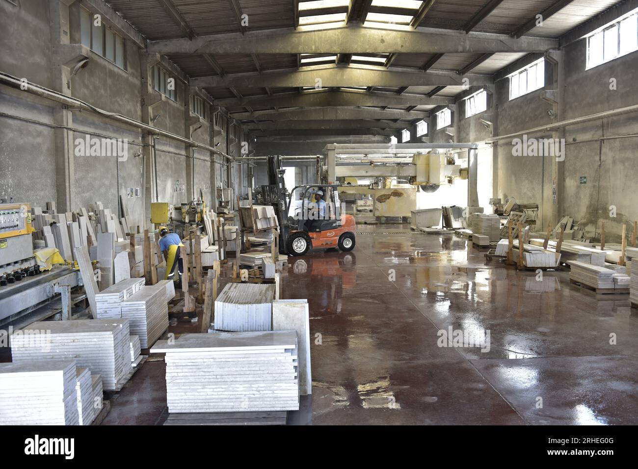man in stone cutting factory/workshop. stone mine. marble mine ...