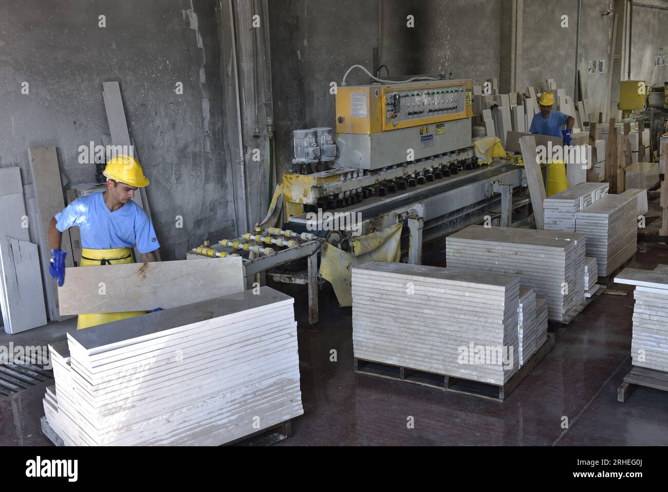 man in stone cutting factory/workshop. stone mine. marble mine ...