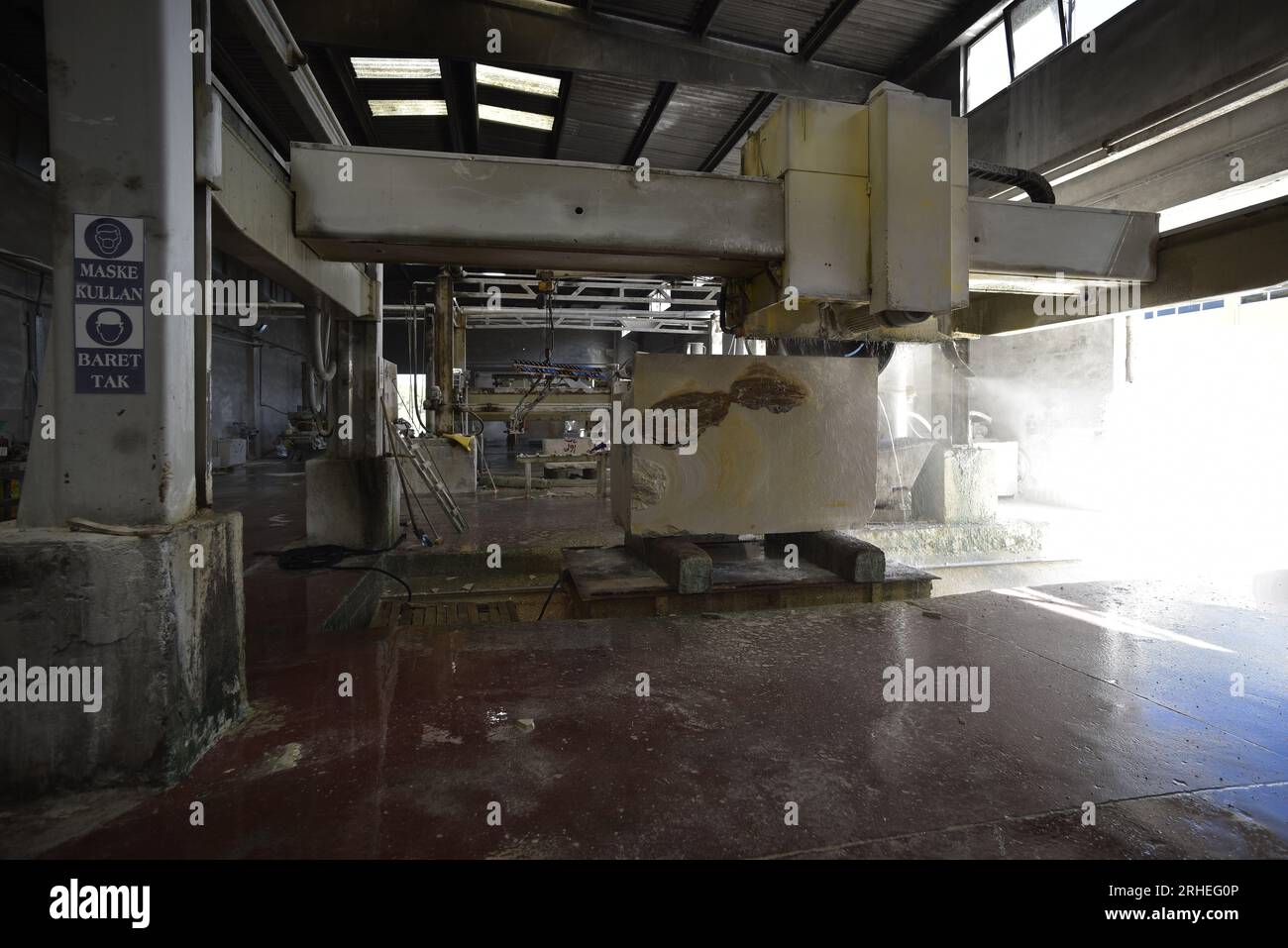 man in stone cutting factory/workshop. stone mine. marble mine ...