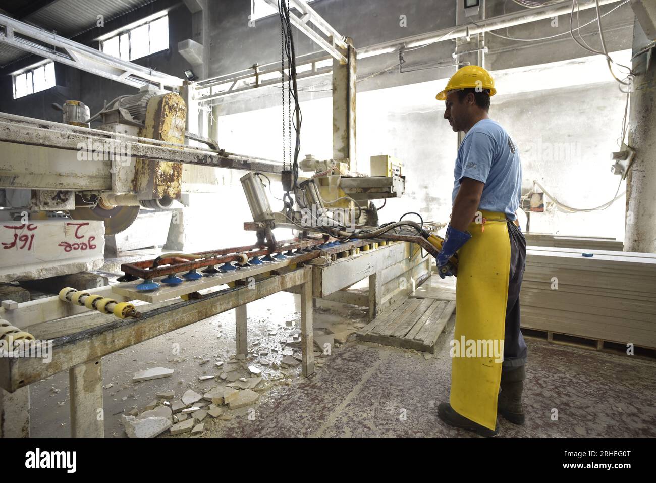 man in stone cutting factory/workshop. stone mine. marble mine ...