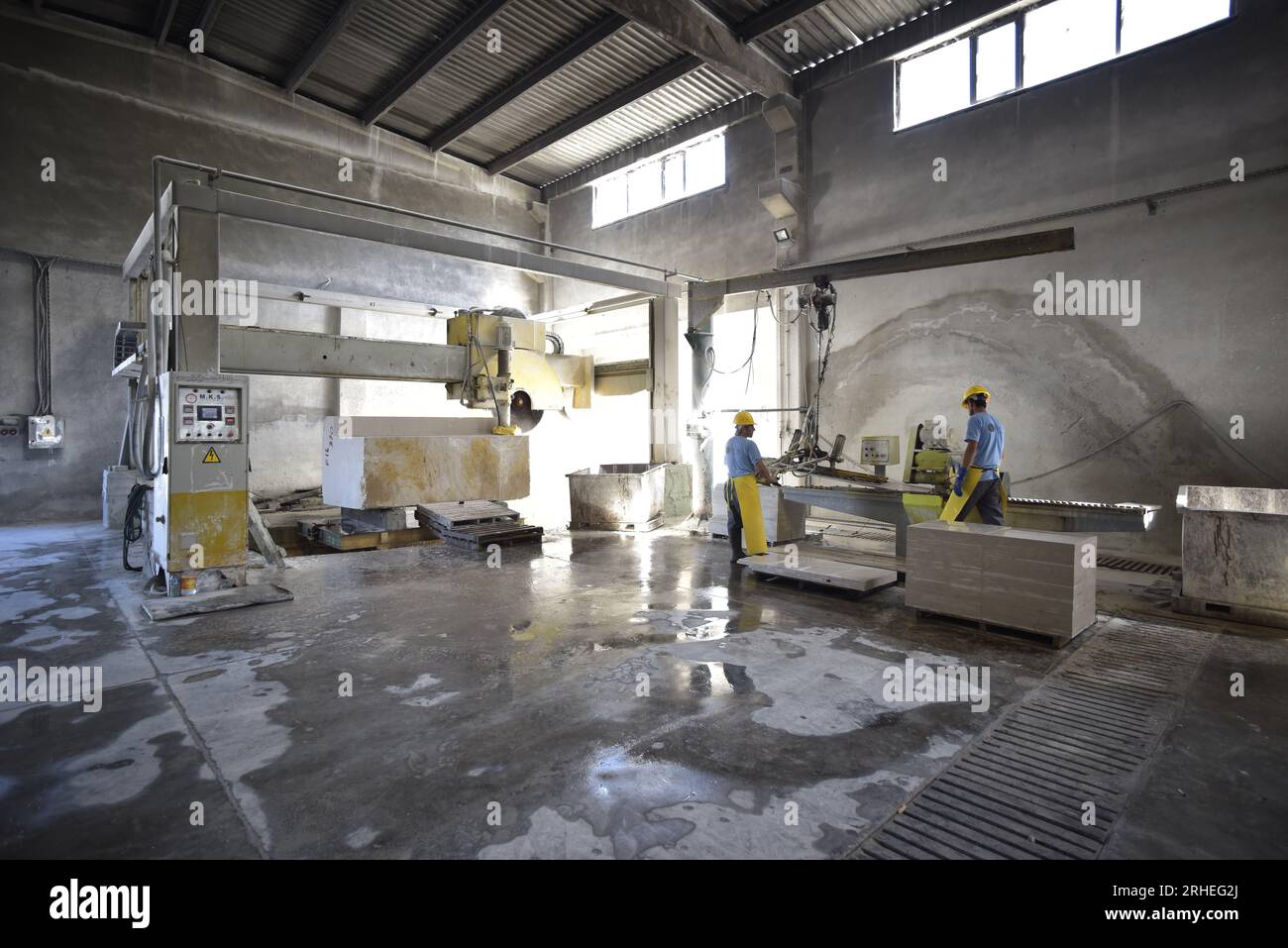 man in stone cutting factory/workshop. stone mine. marble mine ...