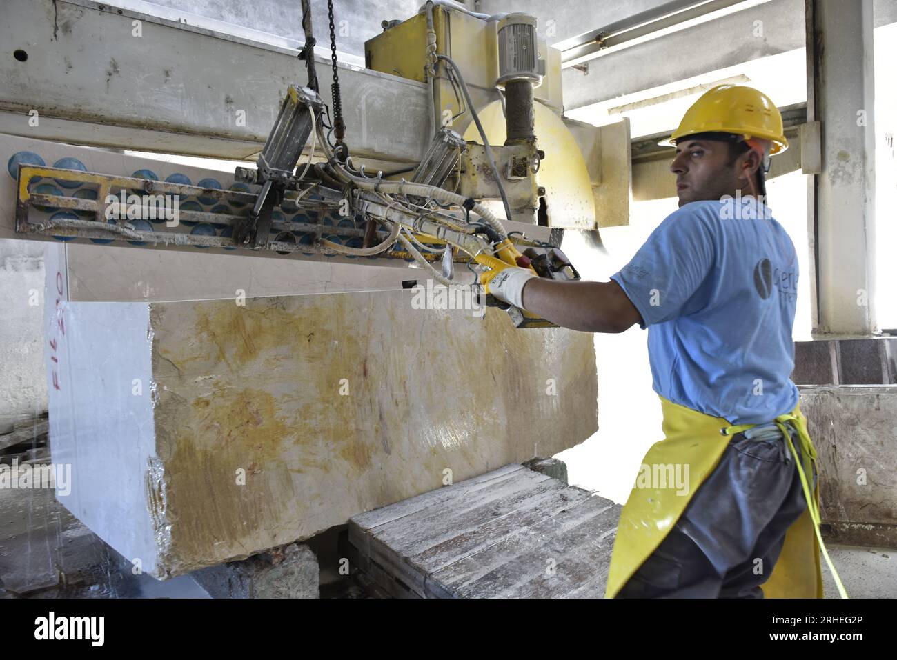 man in stone cutting factory/workshop. stone mine. marble mine ...