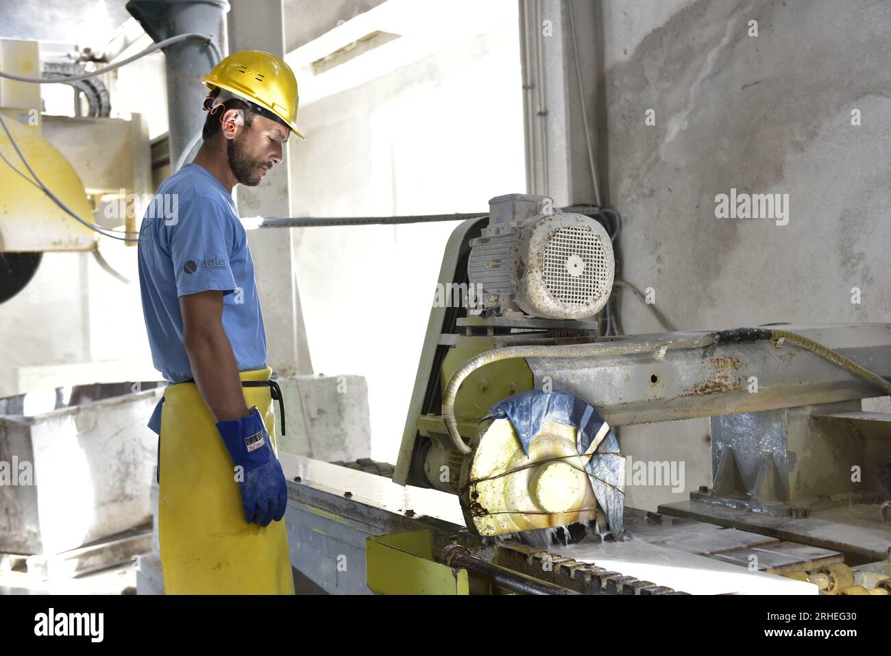 man in stone cutting factory/workshop. stone mine. marble mine ...