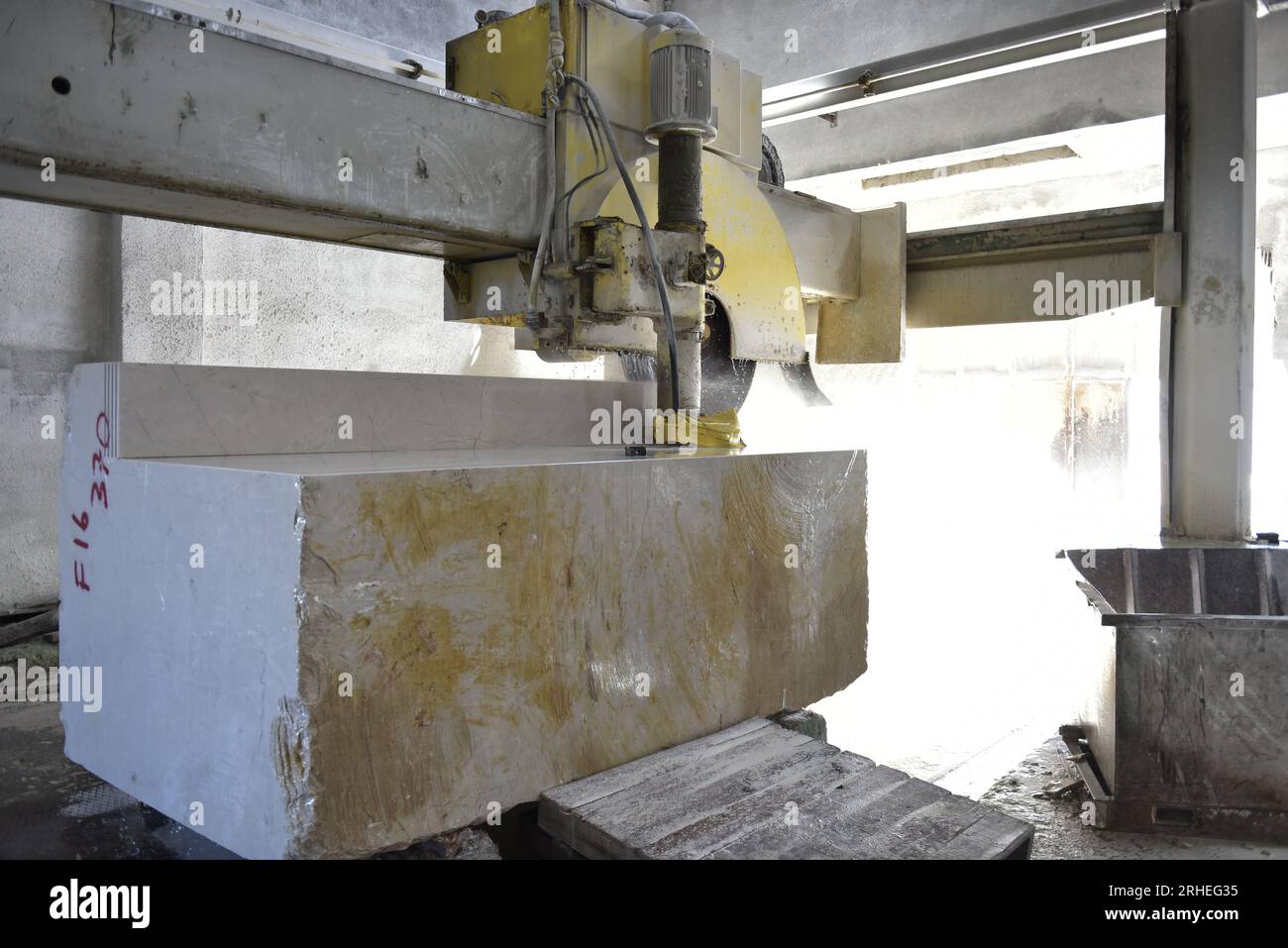 man in stone cutting factory/workshop. stone mine. marble mine ...