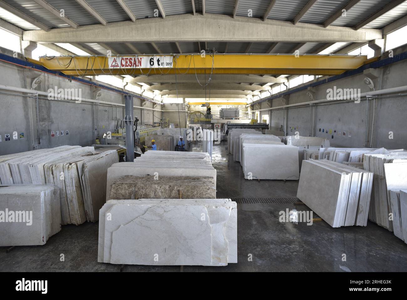 man in stone cutting factory/workshop. stone mine. marble mine ...