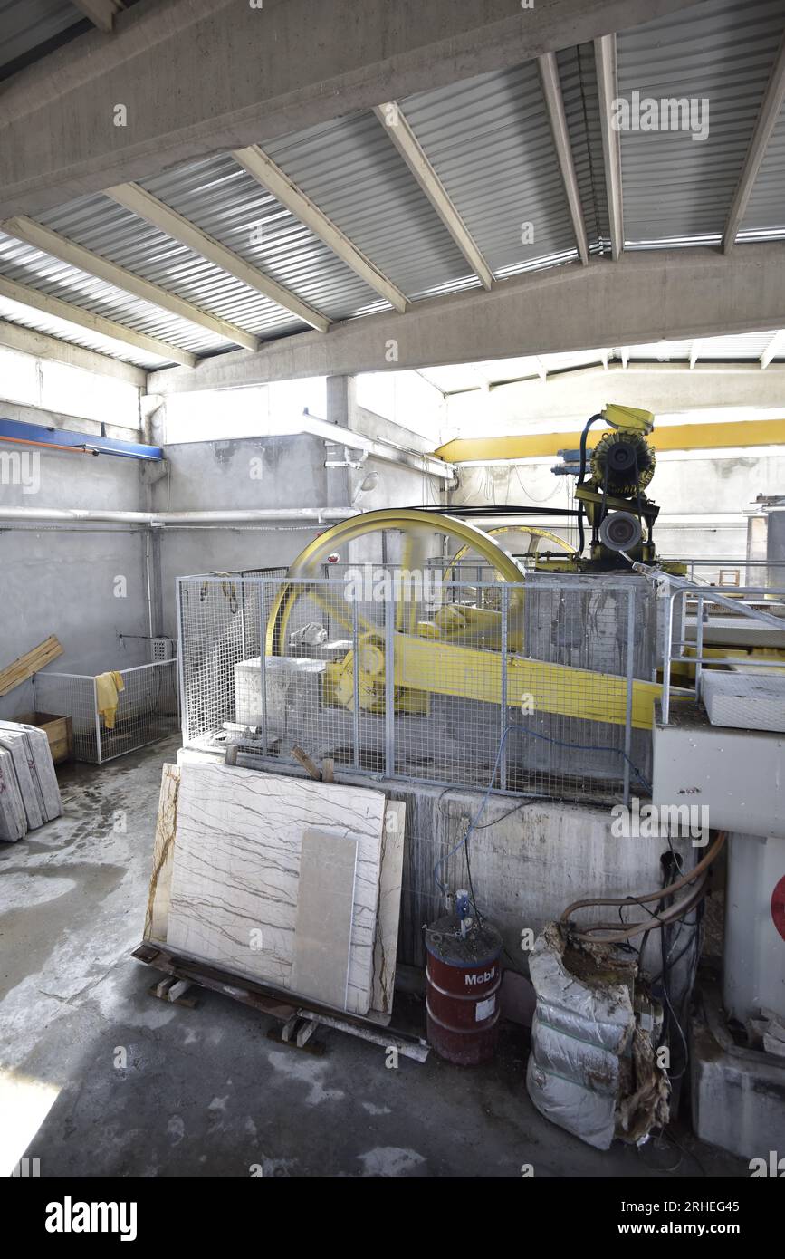 man in stone cutting factory/workshop. stone mine. marble mine ...
