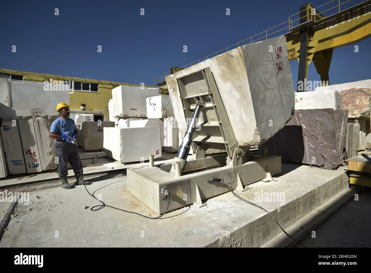 man in stone cutting factory/workshop. stone mine. marble mine ...