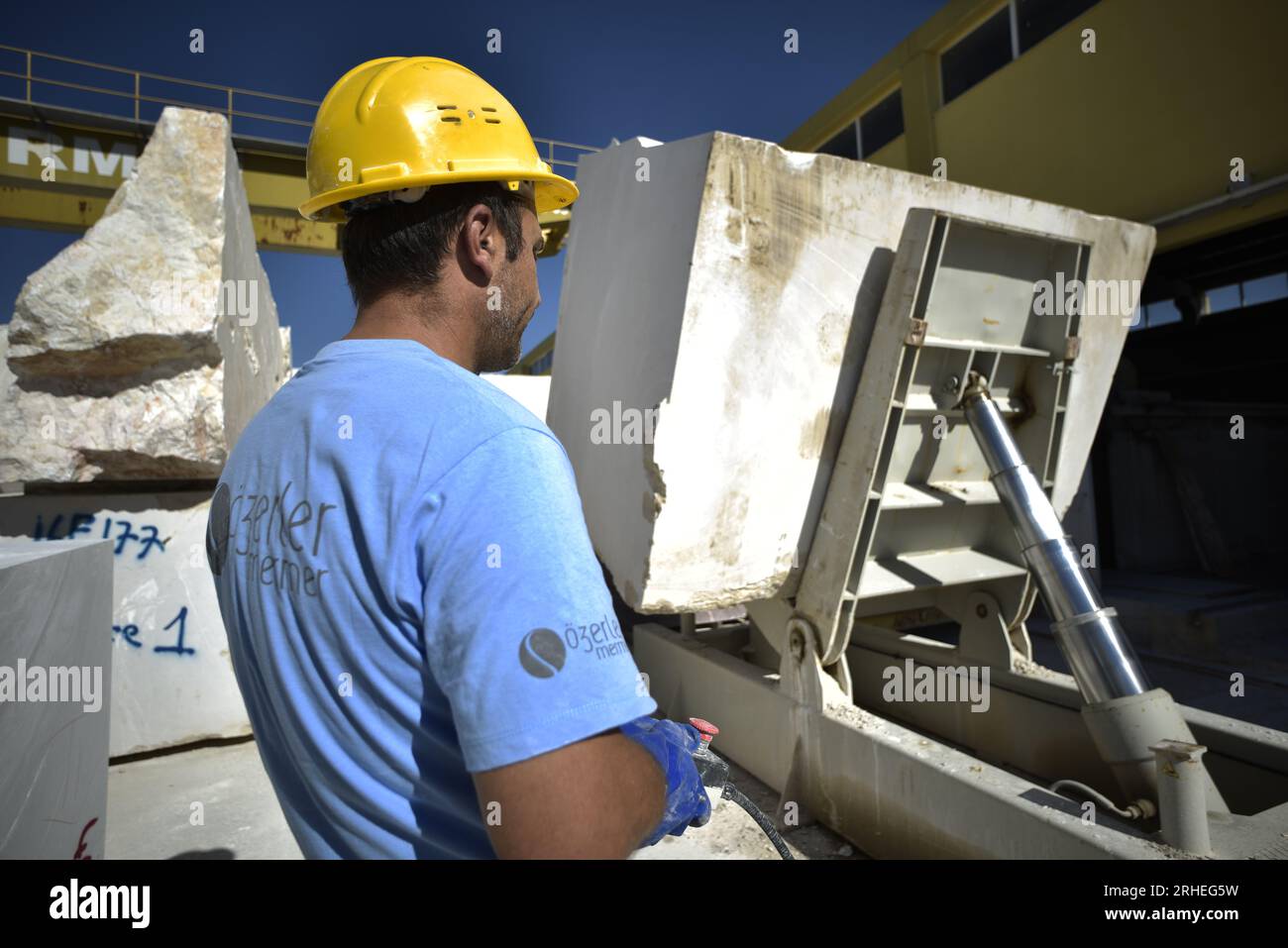 man in stone cutting factory/workshop. stone mine. marble mine ...