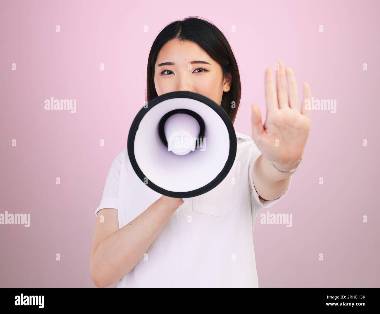 Megaphone announcement, portrait and Asian woman with stop hand sign ...