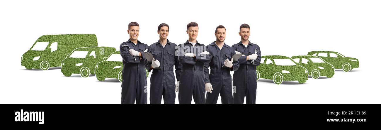 Team of auto mechanic workers posing in front of green electric ...
