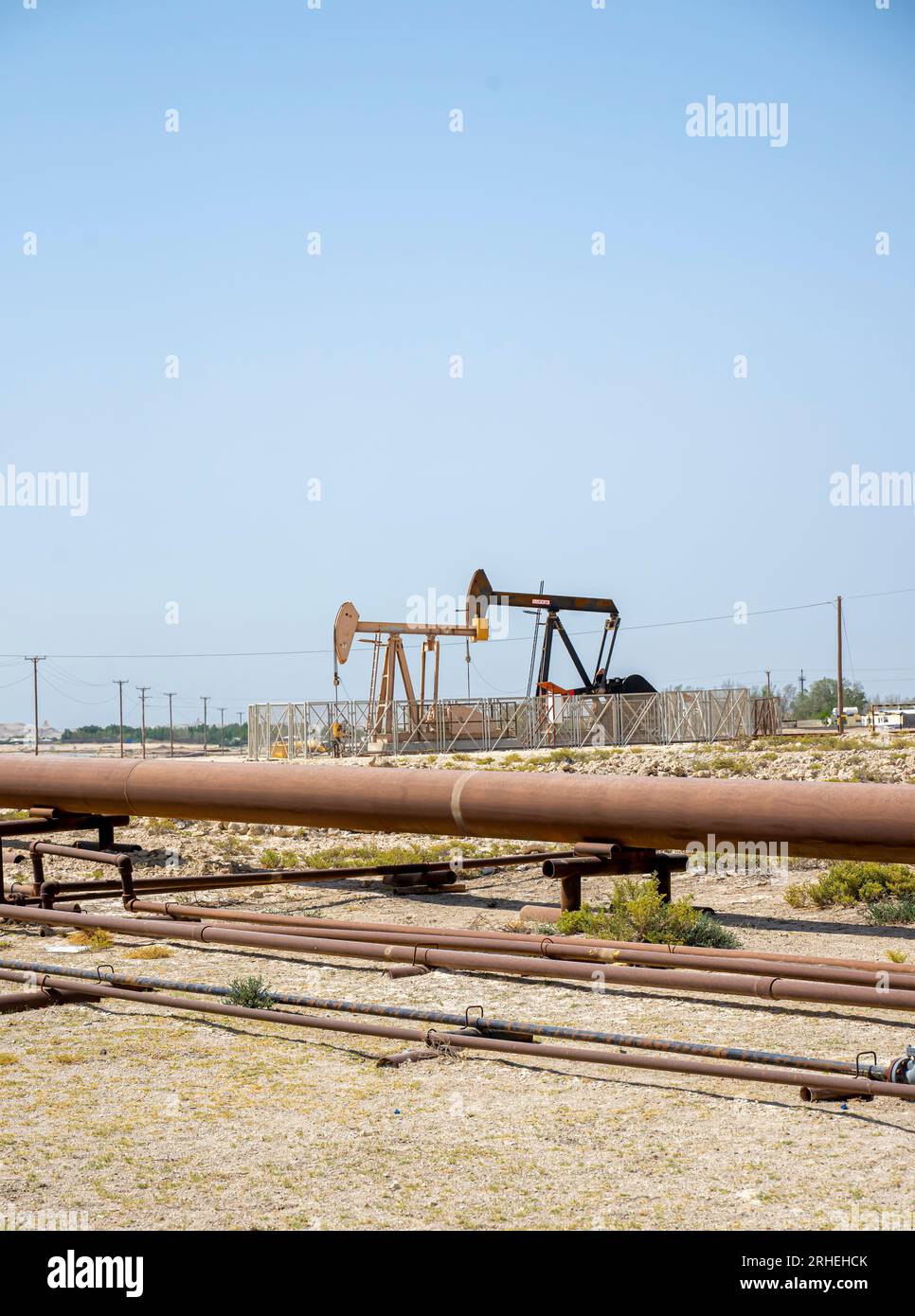 Bahrain oil field infrastructure - oil pipes, pump jack,oil horse, oil ...