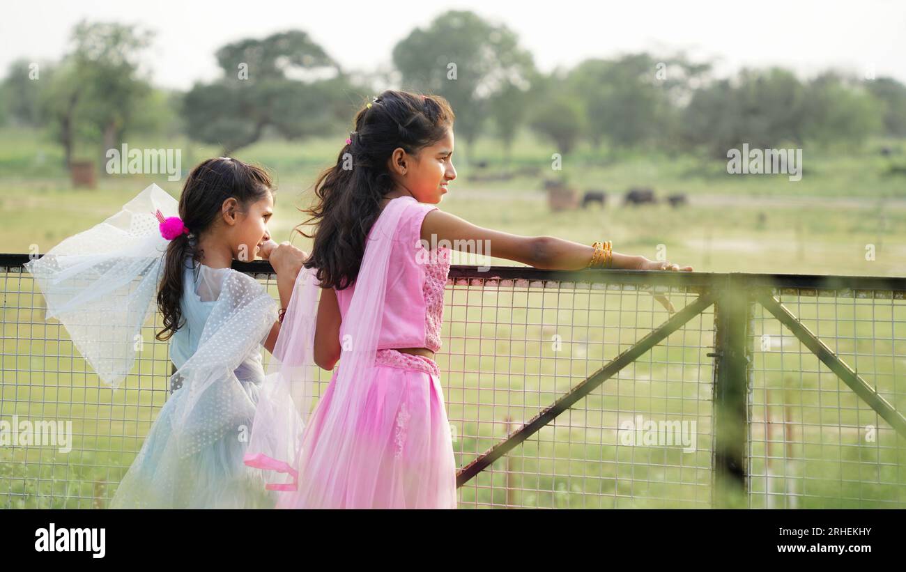Group of happy playful Indian children playing outdoors in spring park ...