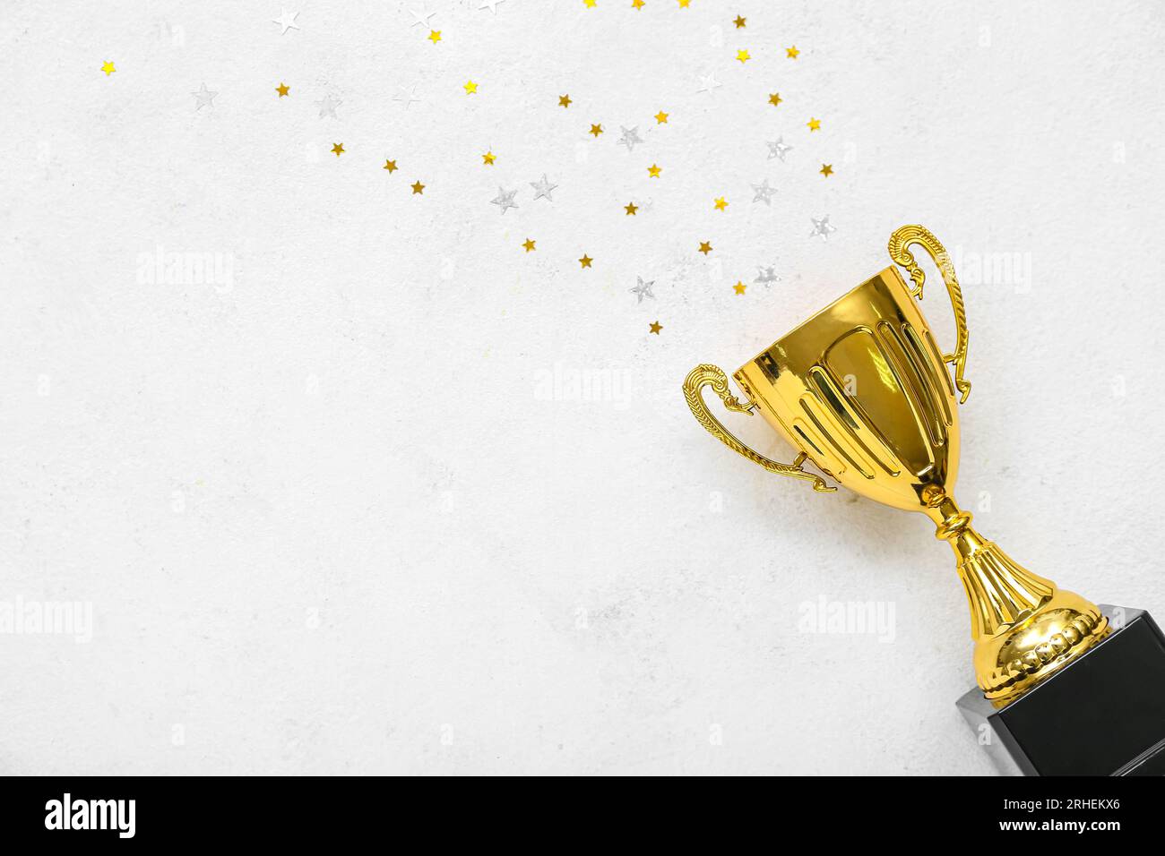 Gold cup with stars on white background Stock Photo - Alamy