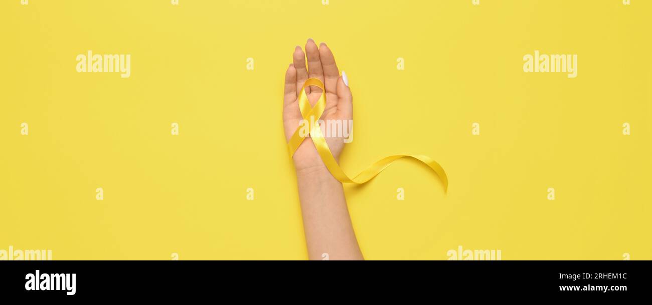 Yellow bladder cancer ribbon hi-res stock photography and images - Alamy
