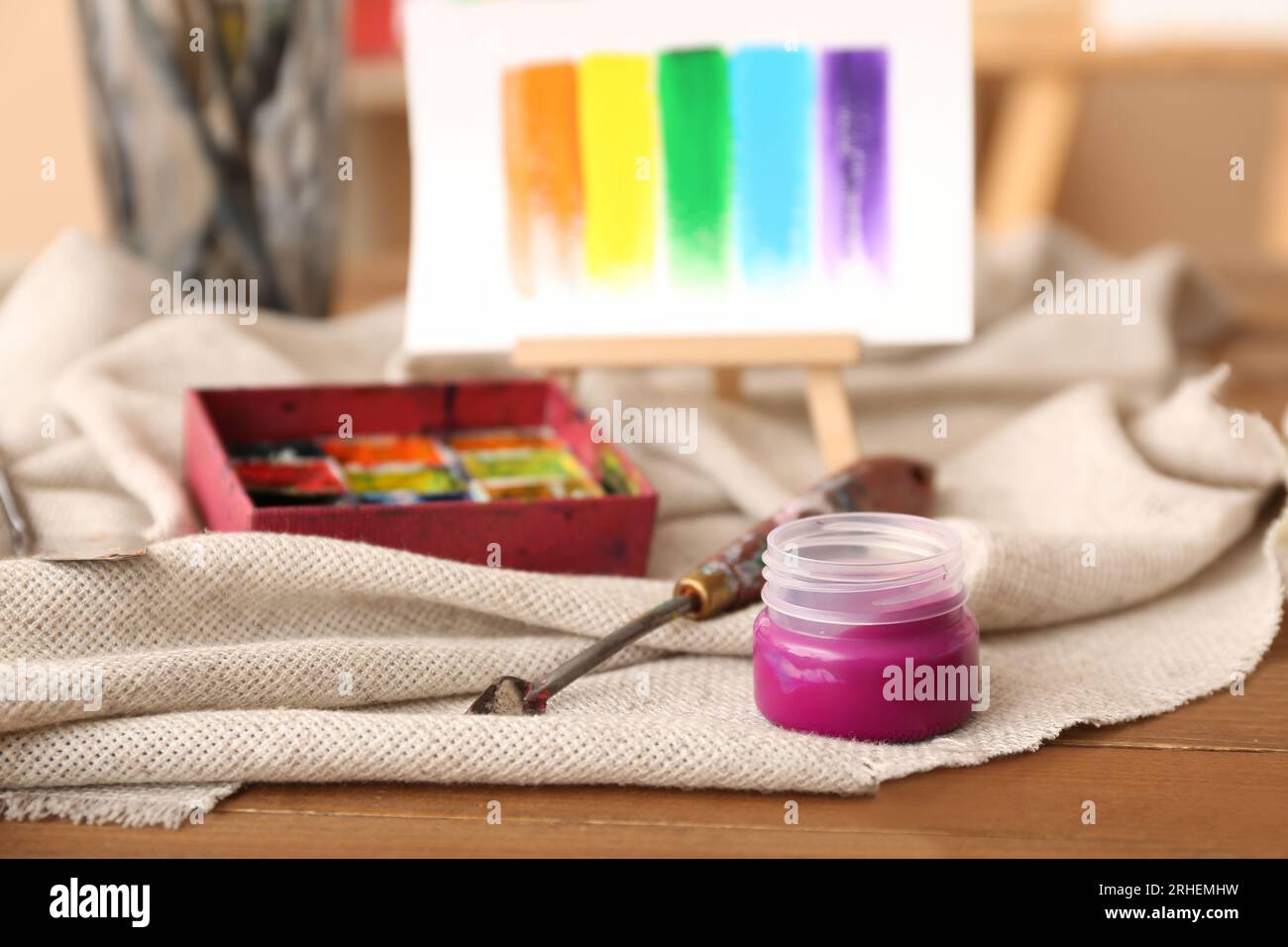 Jar of pink paint in artist's studio Stock Photo - Alamy
