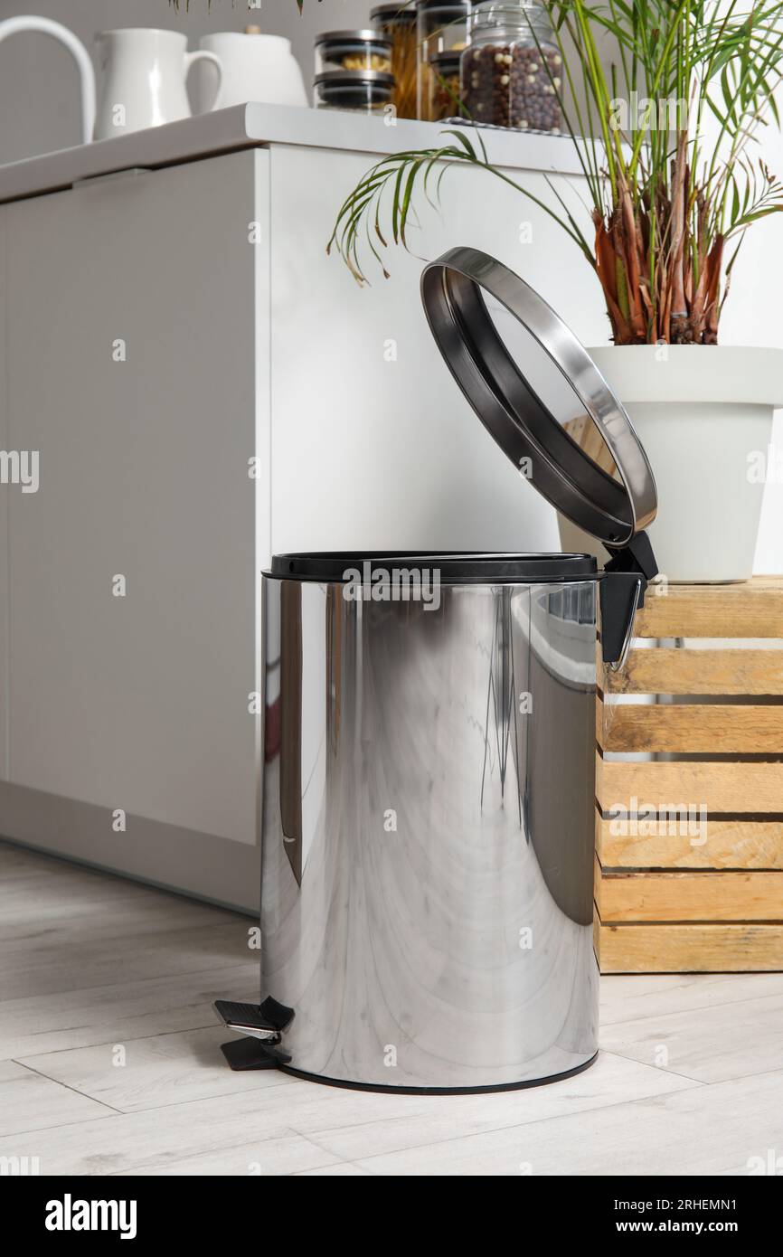 Opened metallic trash bin in interior of modern kitchen Stock Photo - Alamy