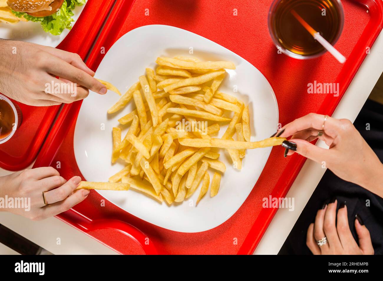 Hands french fries in hi-res stock photography and images - Alamy