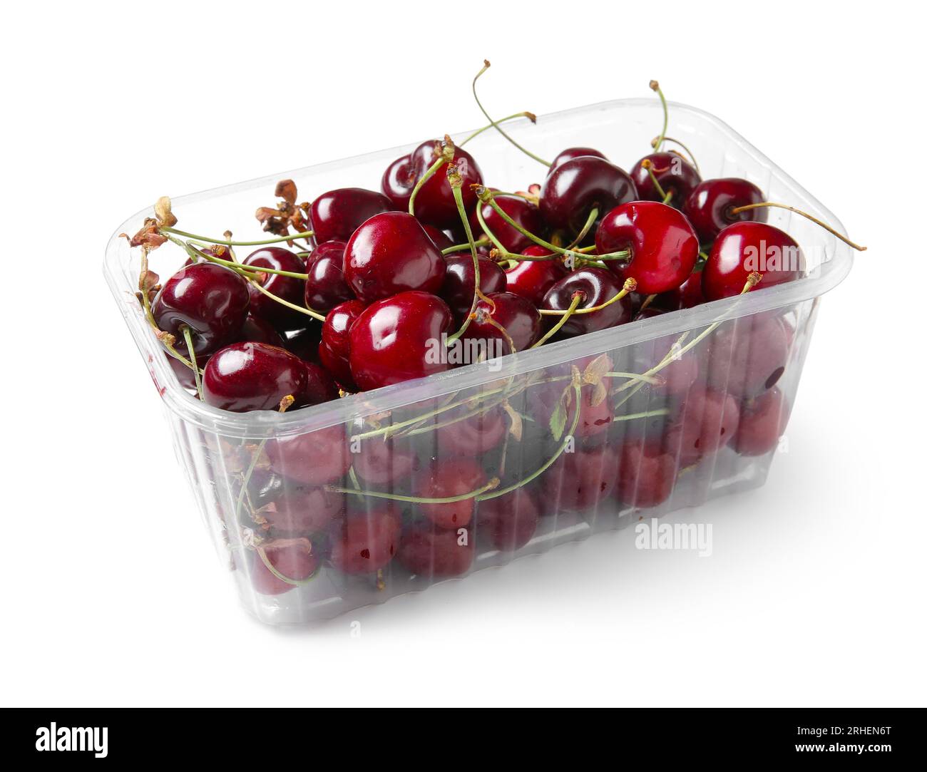 Plastic container with fresh cherry on white background Stock Photo - Alamy