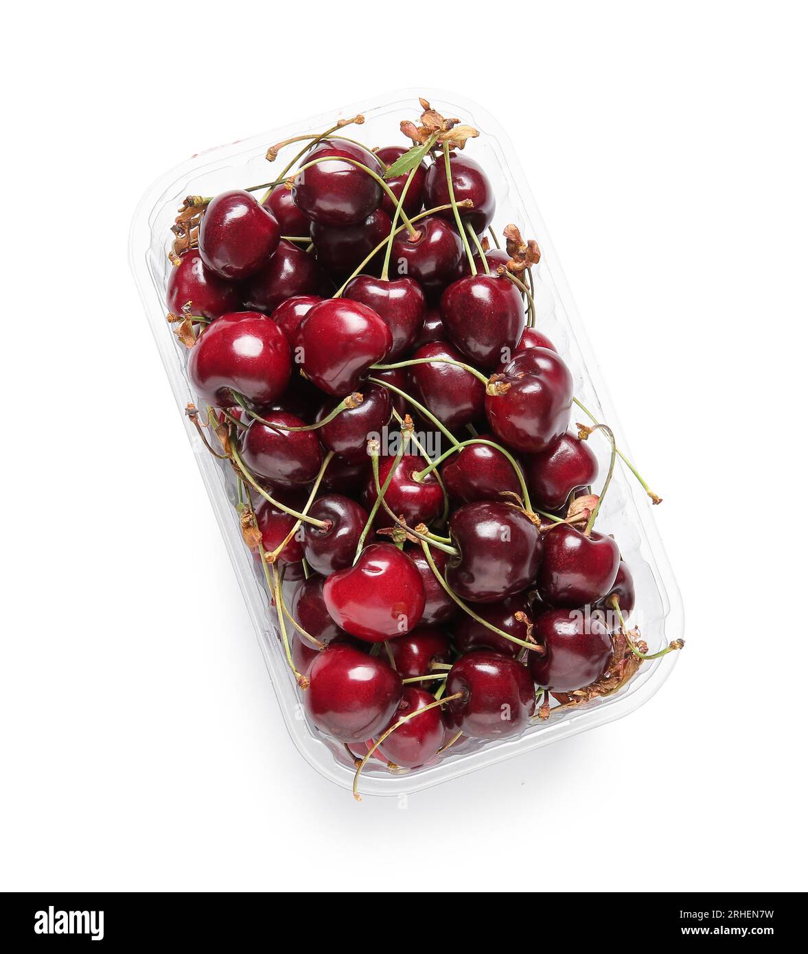 Plastic container with fresh cherry on white background Stock Photo - Alamy