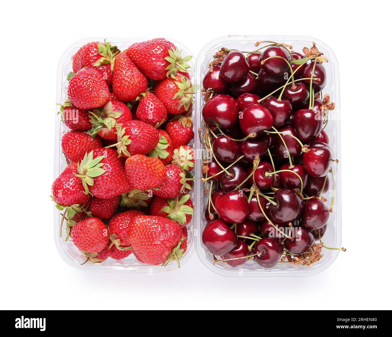 Plastic containers with fresh strawberry and cherry on white background ...
