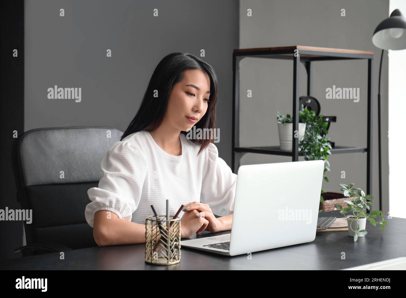 Female Asian HR specialist interviewing candidate online Stock Photo ...