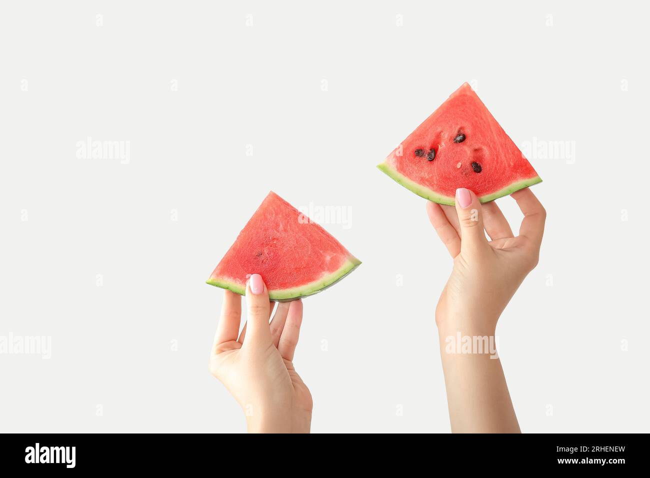 Female hands with pieces of ripe watermelon on white background Stock ...