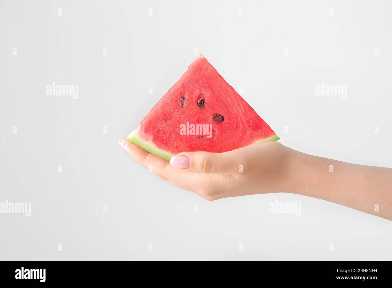 Female hand with piece of ripe watermelon on white background Stock ...