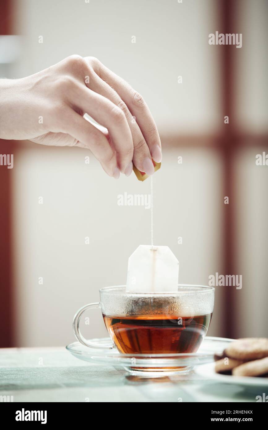 Woman hand teabag hi-res stock photography and images - Alamy